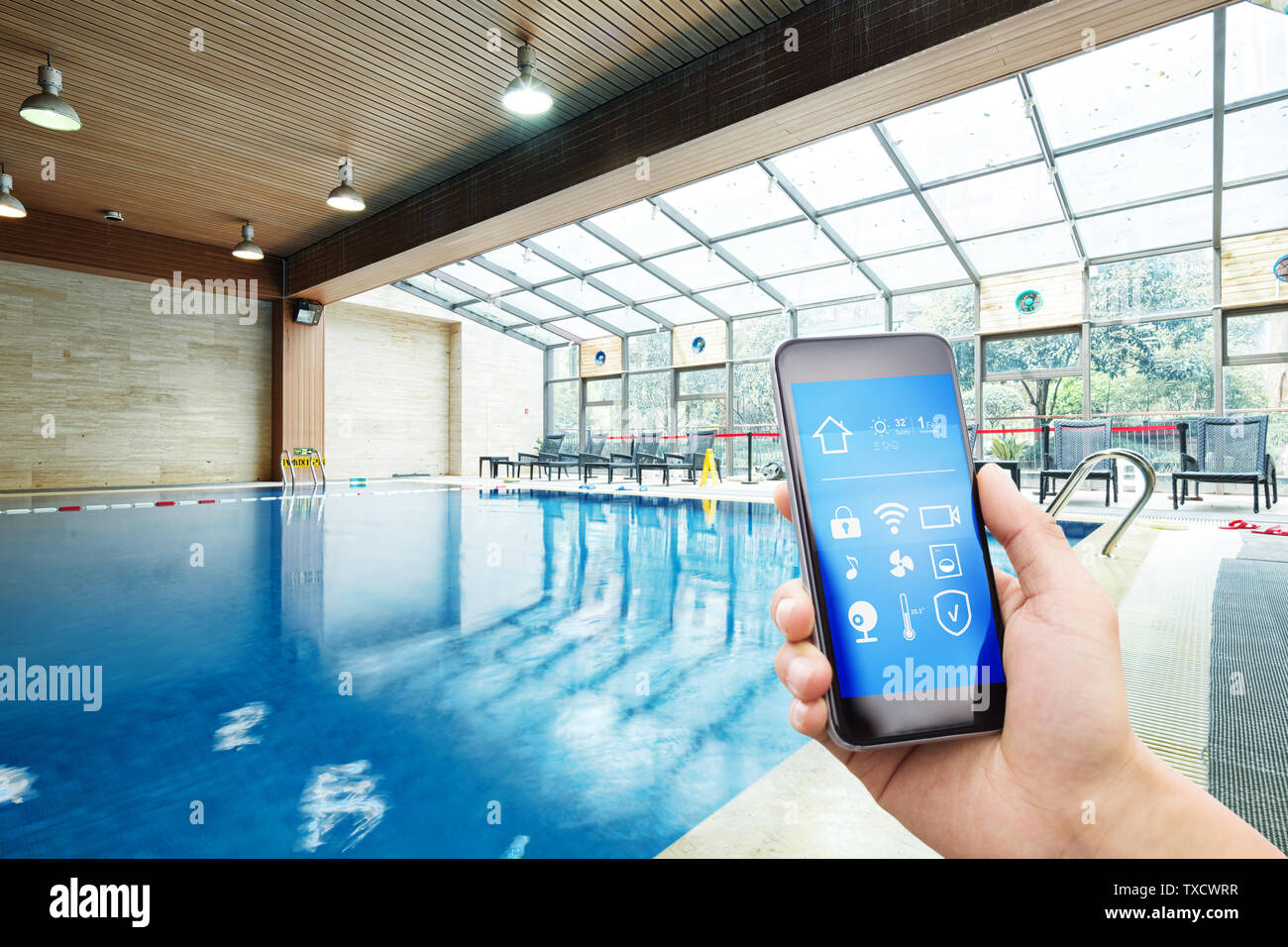 smart phone with smart home with modern swimming pool Stock Photo - Alamy