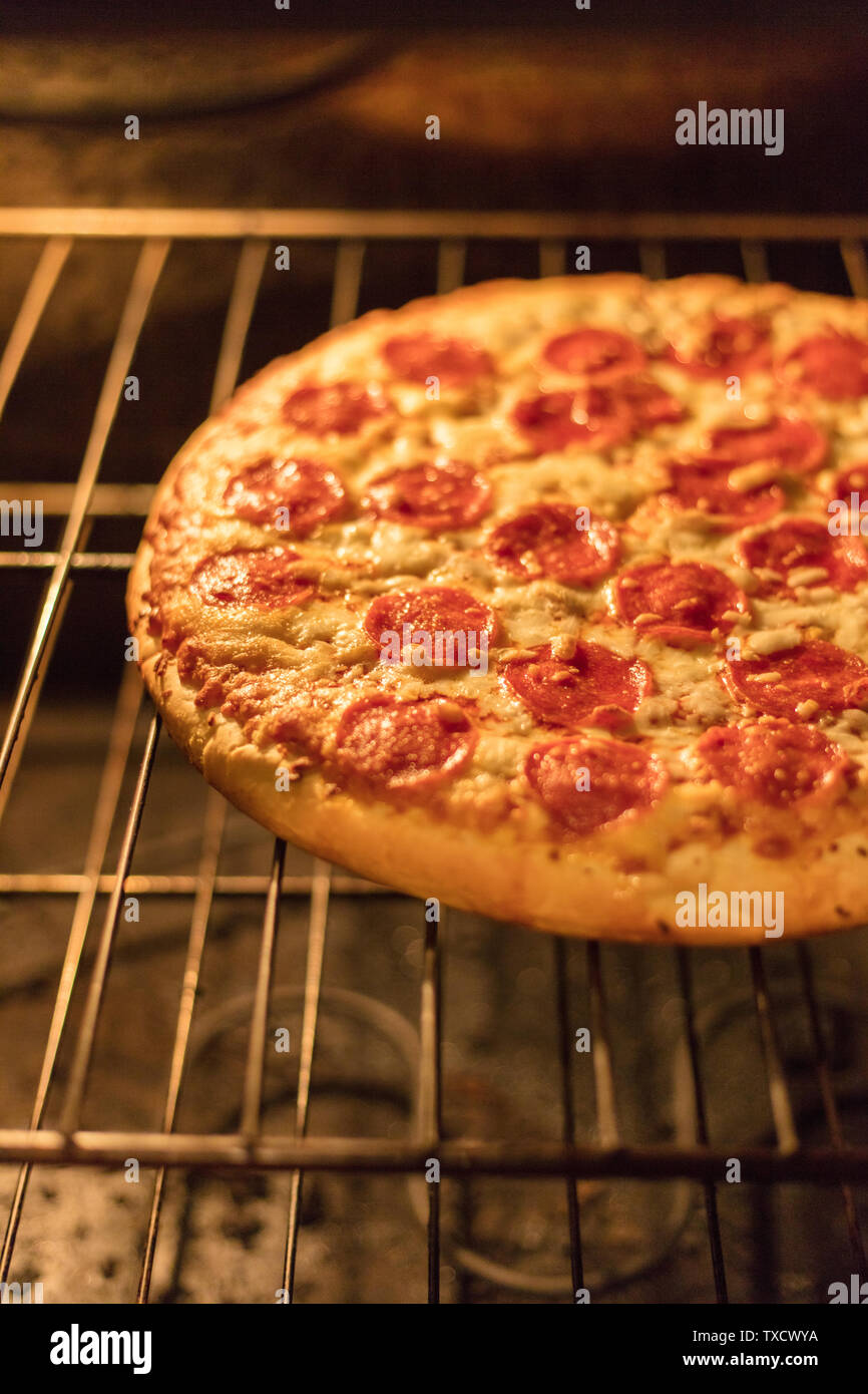 Italian red intestine pizza in the oven Stock Photo - Alamy