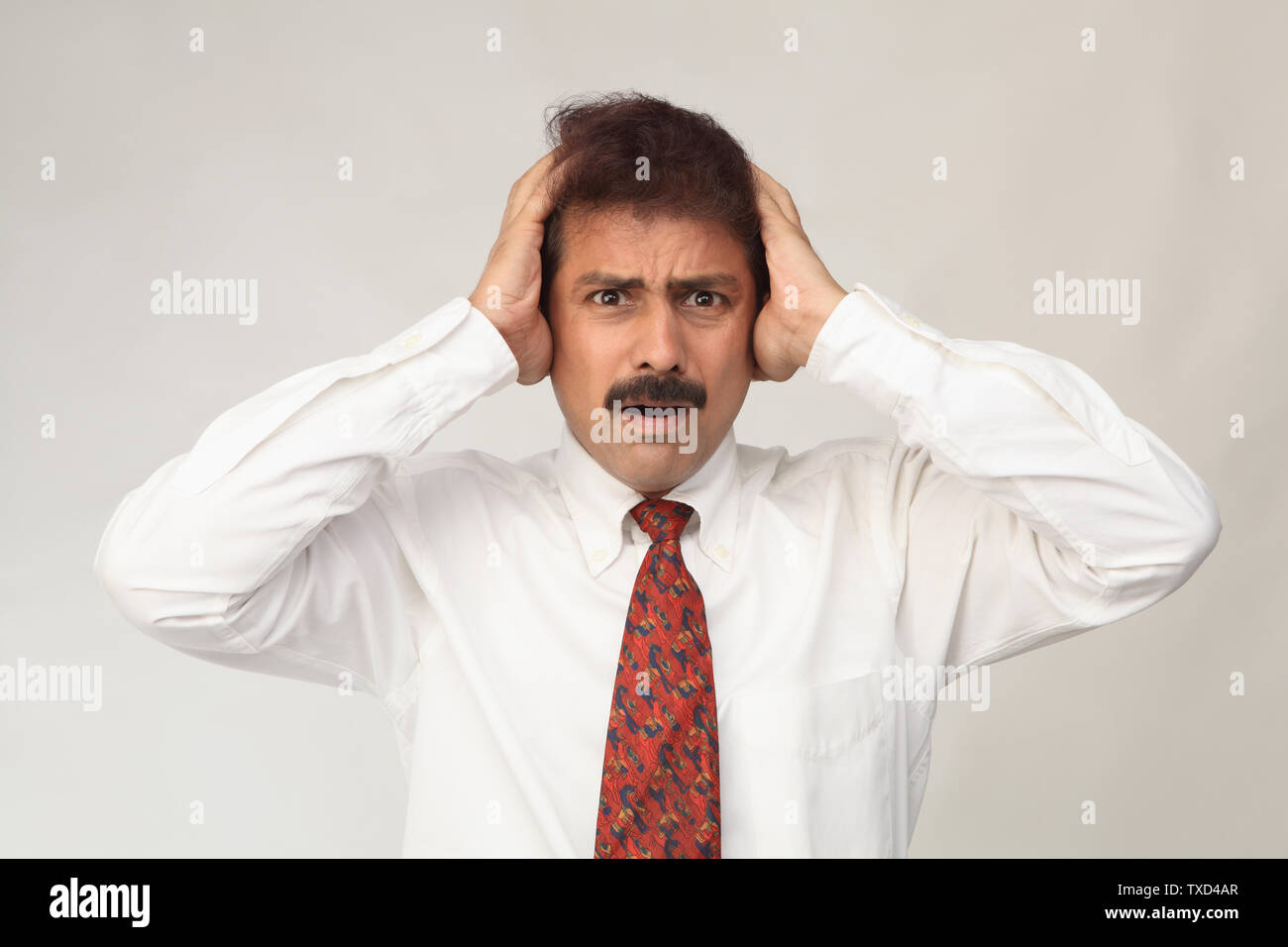 Shocked mature indian man hands hi-res stock photography and images - Alamy