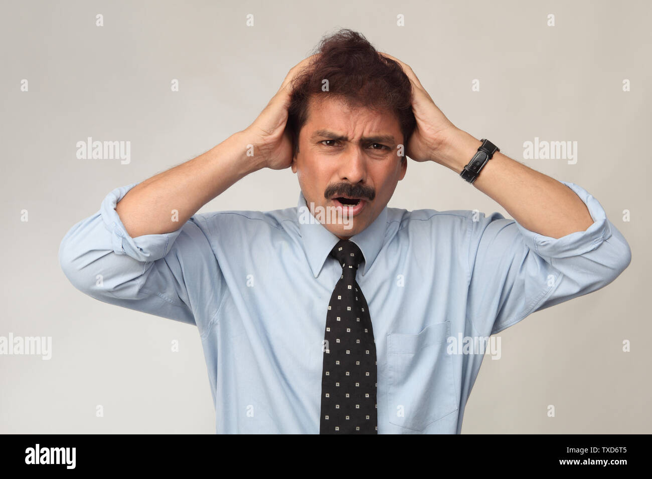 Shocked mature indian man hands hi-res stock photography and images - Alamy