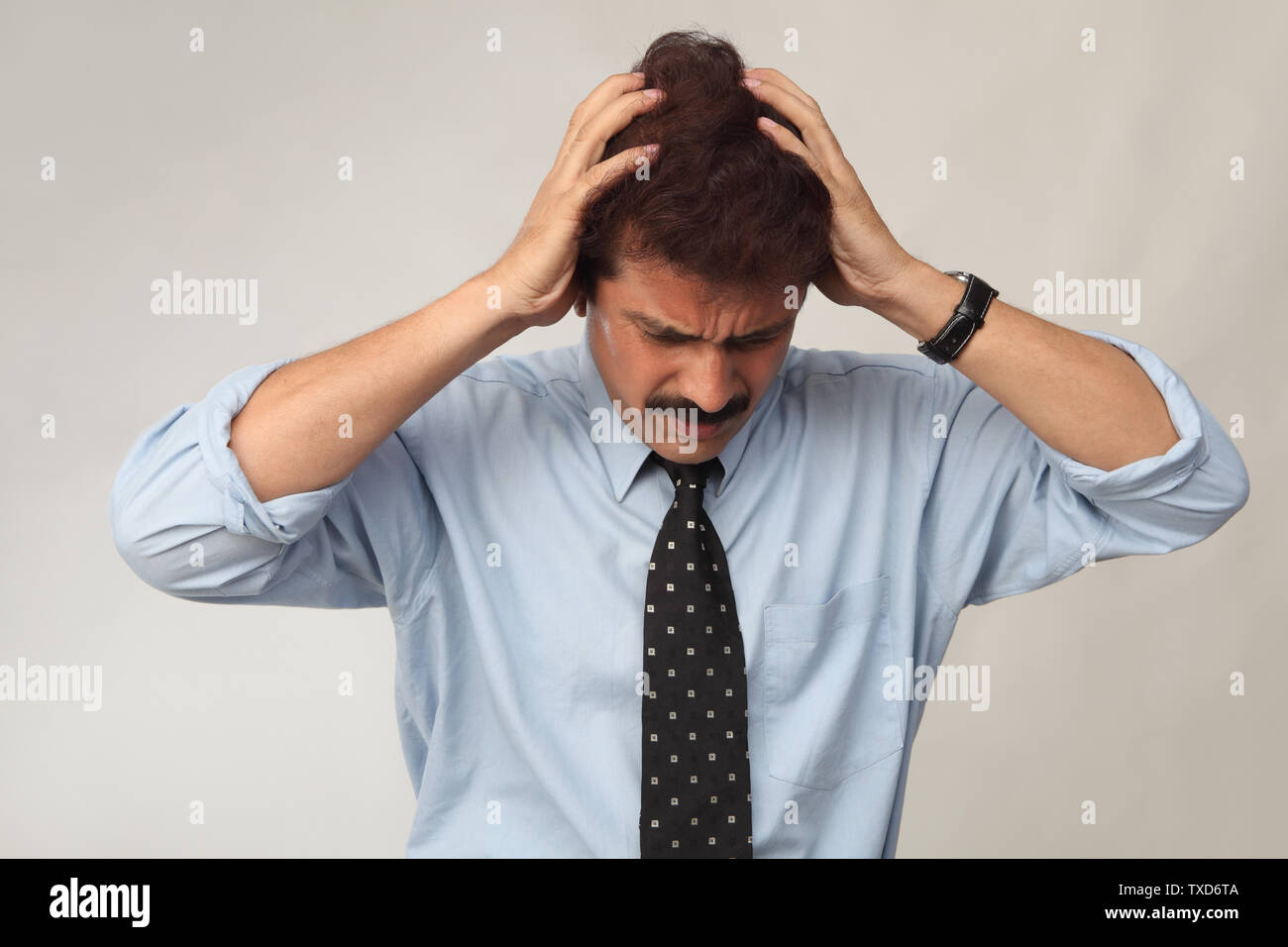 Businessman head down in disappointment hi-res stock photography and ...