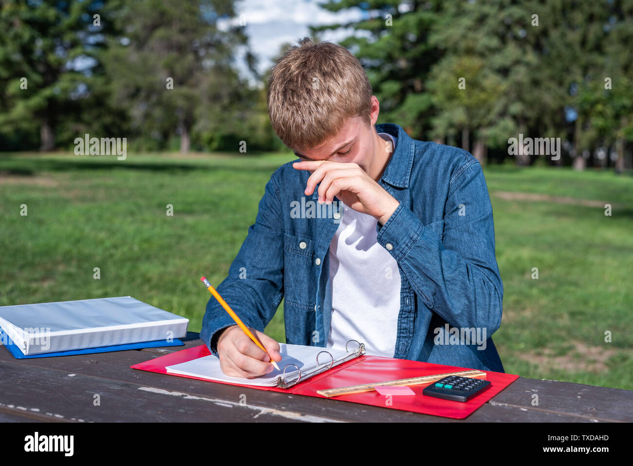 Frustrated teen boy working hi-res stock photography and images - Alamy
