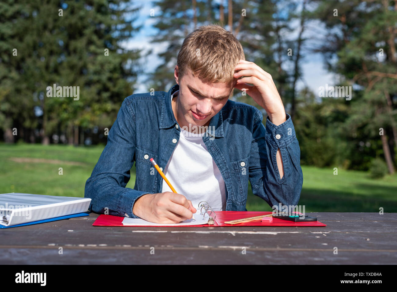 Frustrated teen boy working hi-res stock photography and images - Alamy