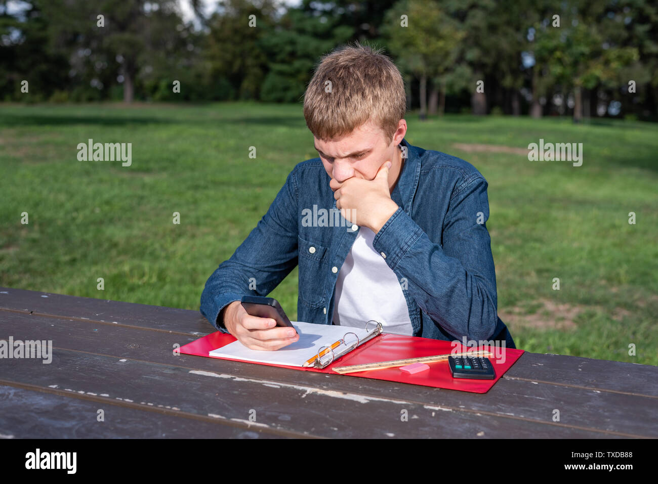 Teenage boy homework distracted hi-res stock photography and images - Alamy