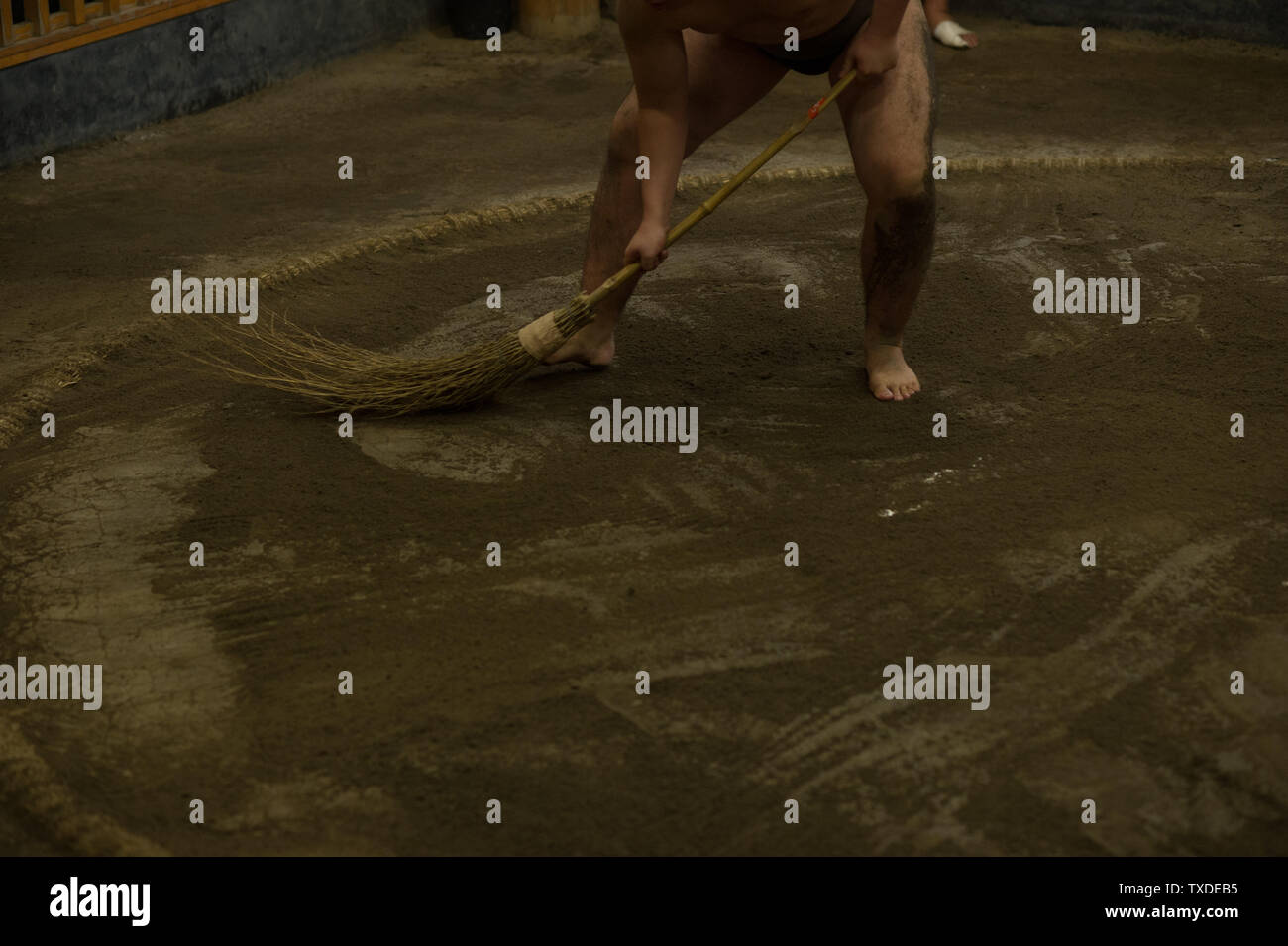 Several athletes of various rank warm up and practice sume wrestling at ...