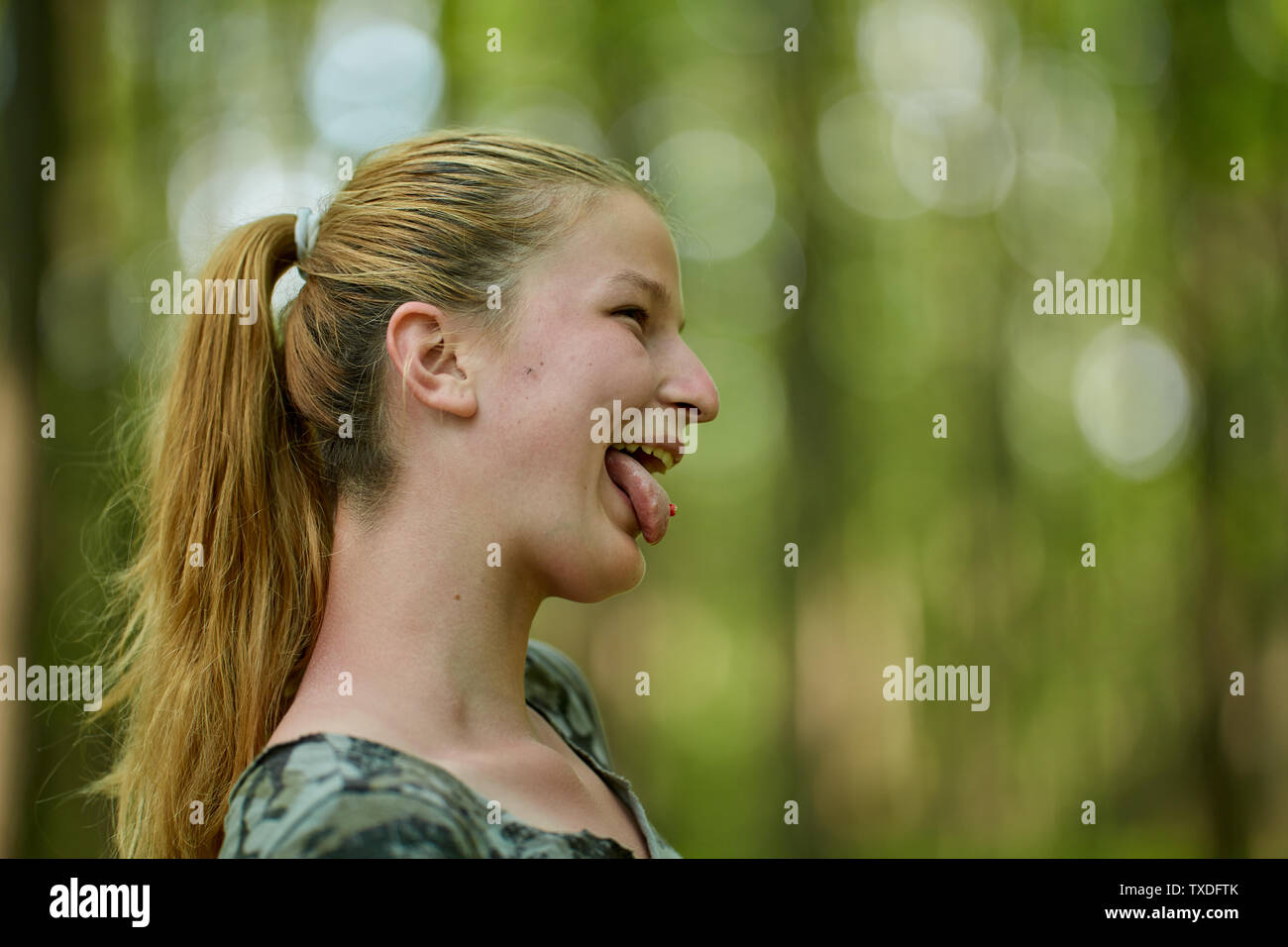 Portrait of a beautiful blonde woman with piercing Stock Photo - Alamy
