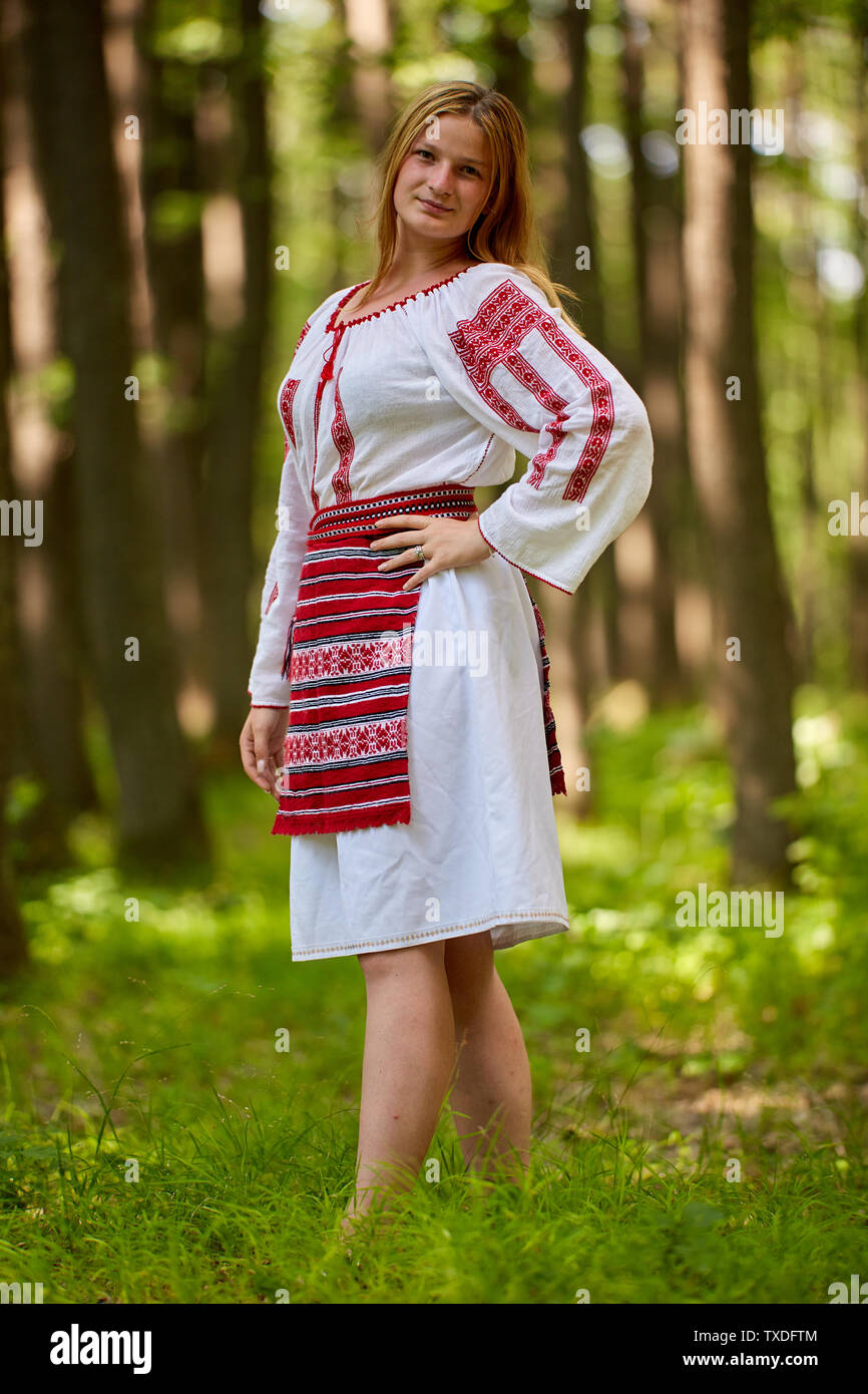Portrait of a Romanian girl in traditional costume in an oak forest Stock Photo - Alamy