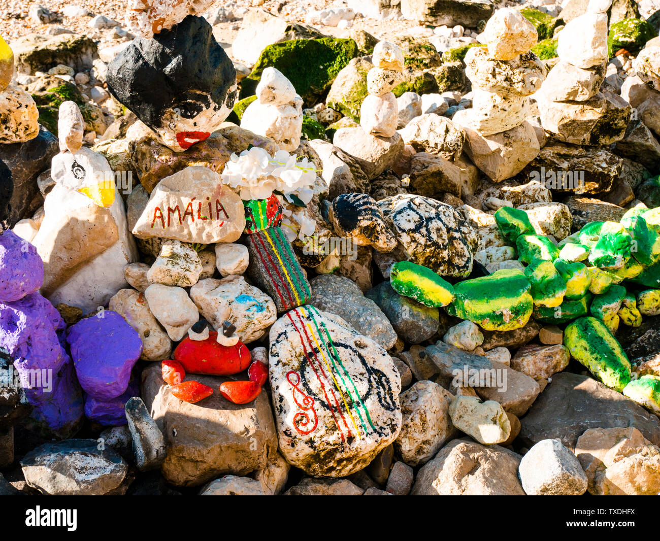 stones painted like people on the bank of the Tagus river Stock Photo ...