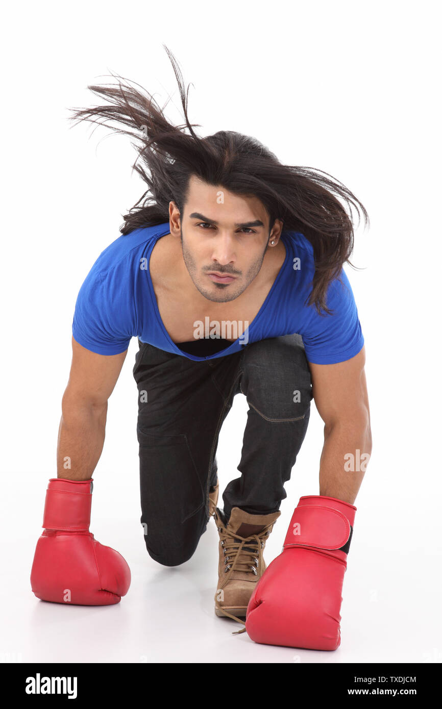 Portrait of a man wearing boxing gloves Stock Photo - Alamy