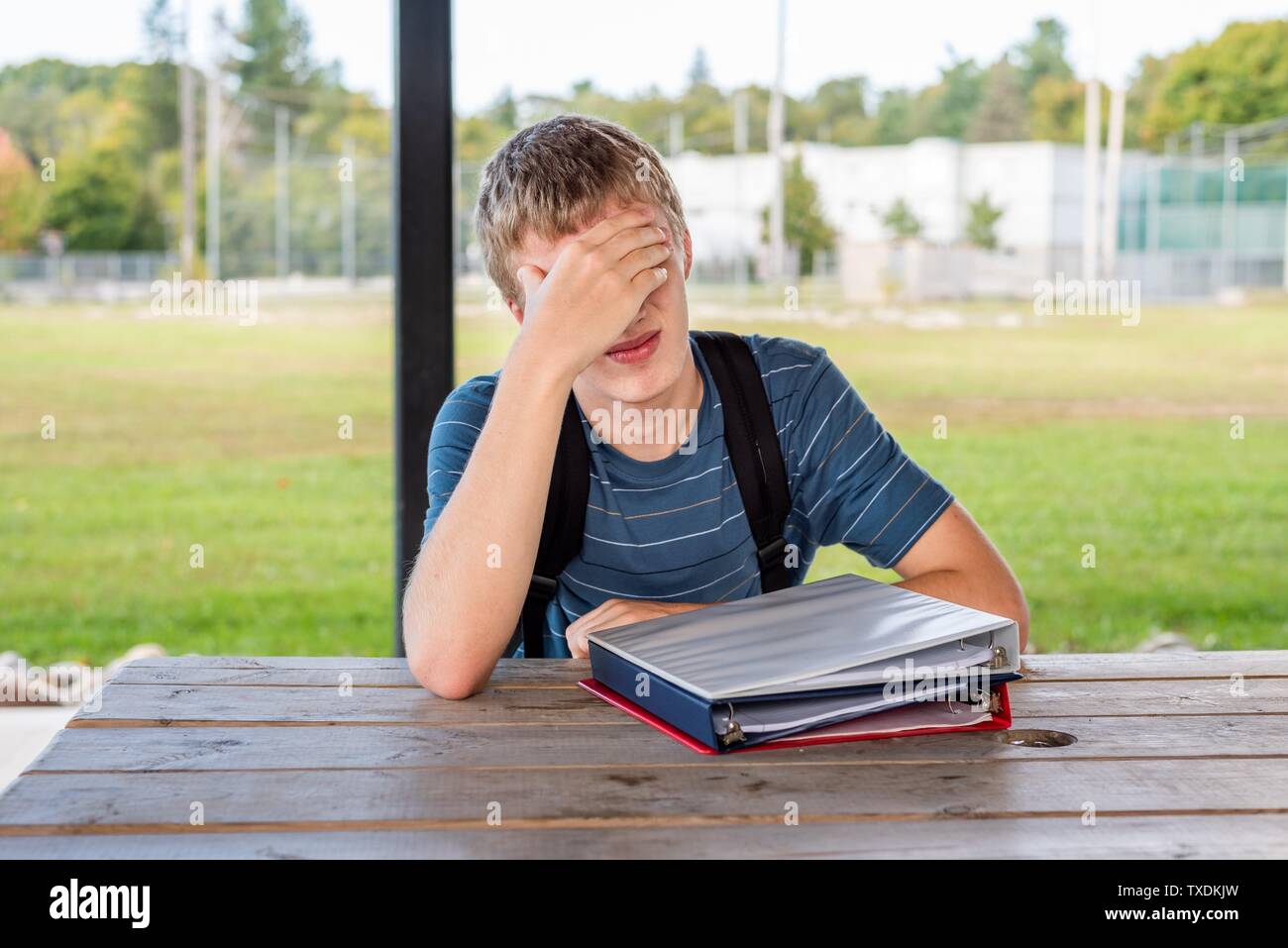 Teenage Boy Thinking Notebook Stock Photos & Teenage Boy Thinking Notebook Stock Images - Alamy