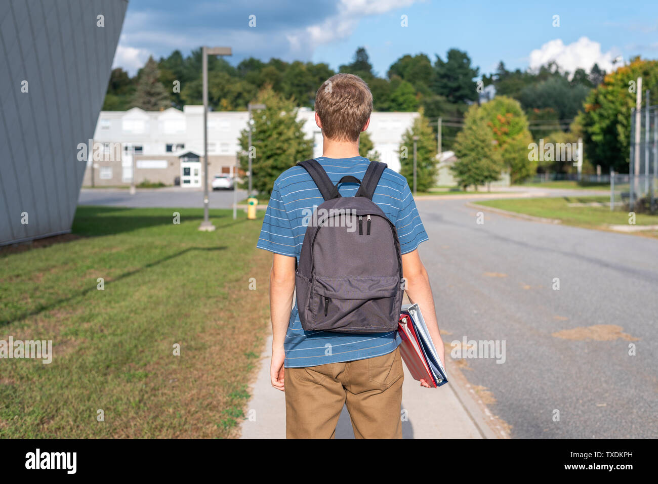 Male high school student walking hi-res stock photography and images ...