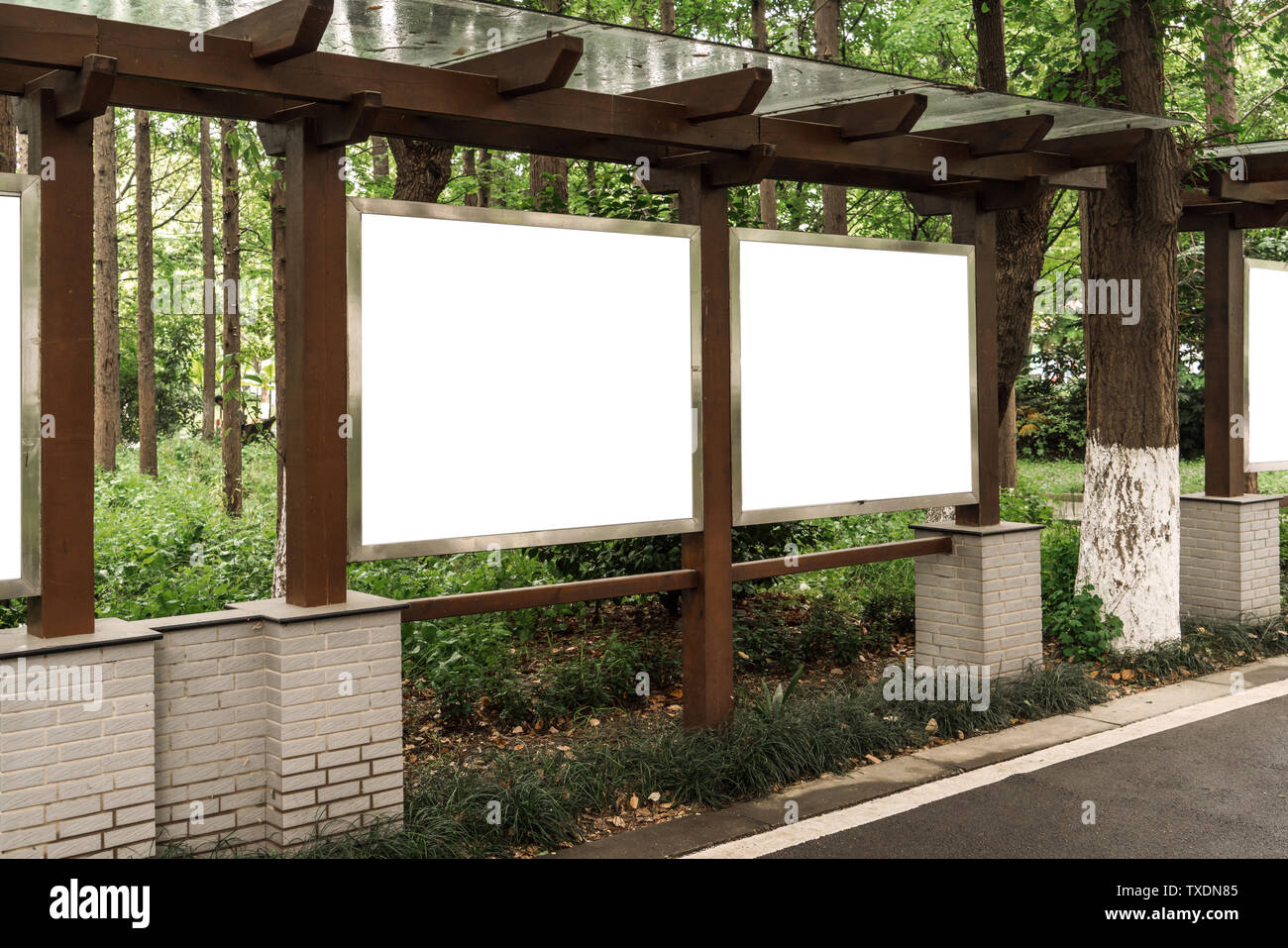 Billboards in the woods Stock Photo - Alamy