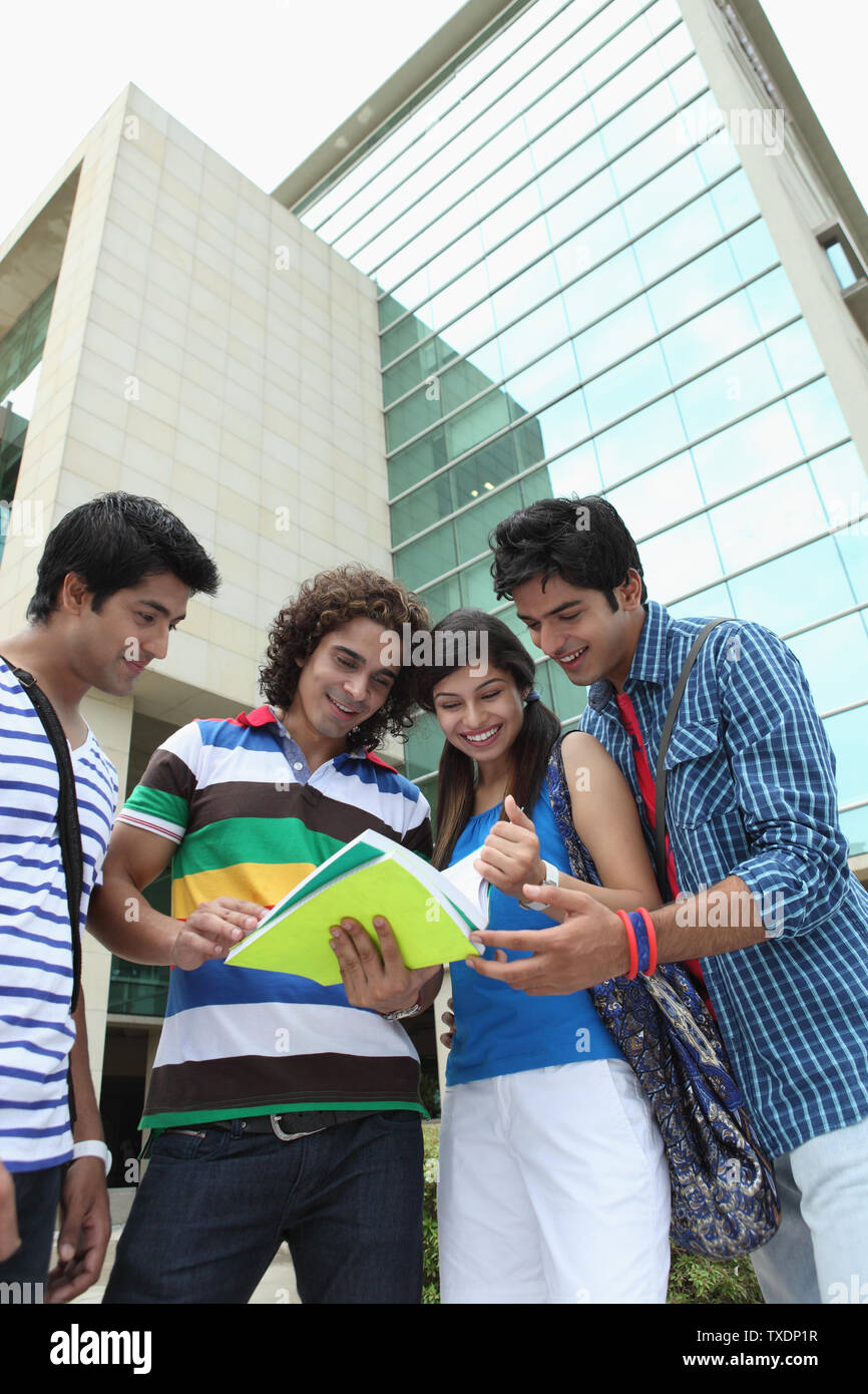 Indian college students reading book hi-res stock photography and ...
