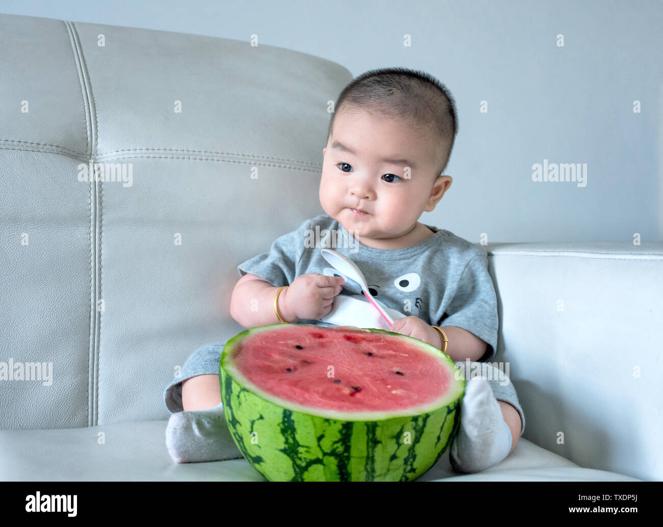 Baby eating watermelon Stock Photo - Alamy