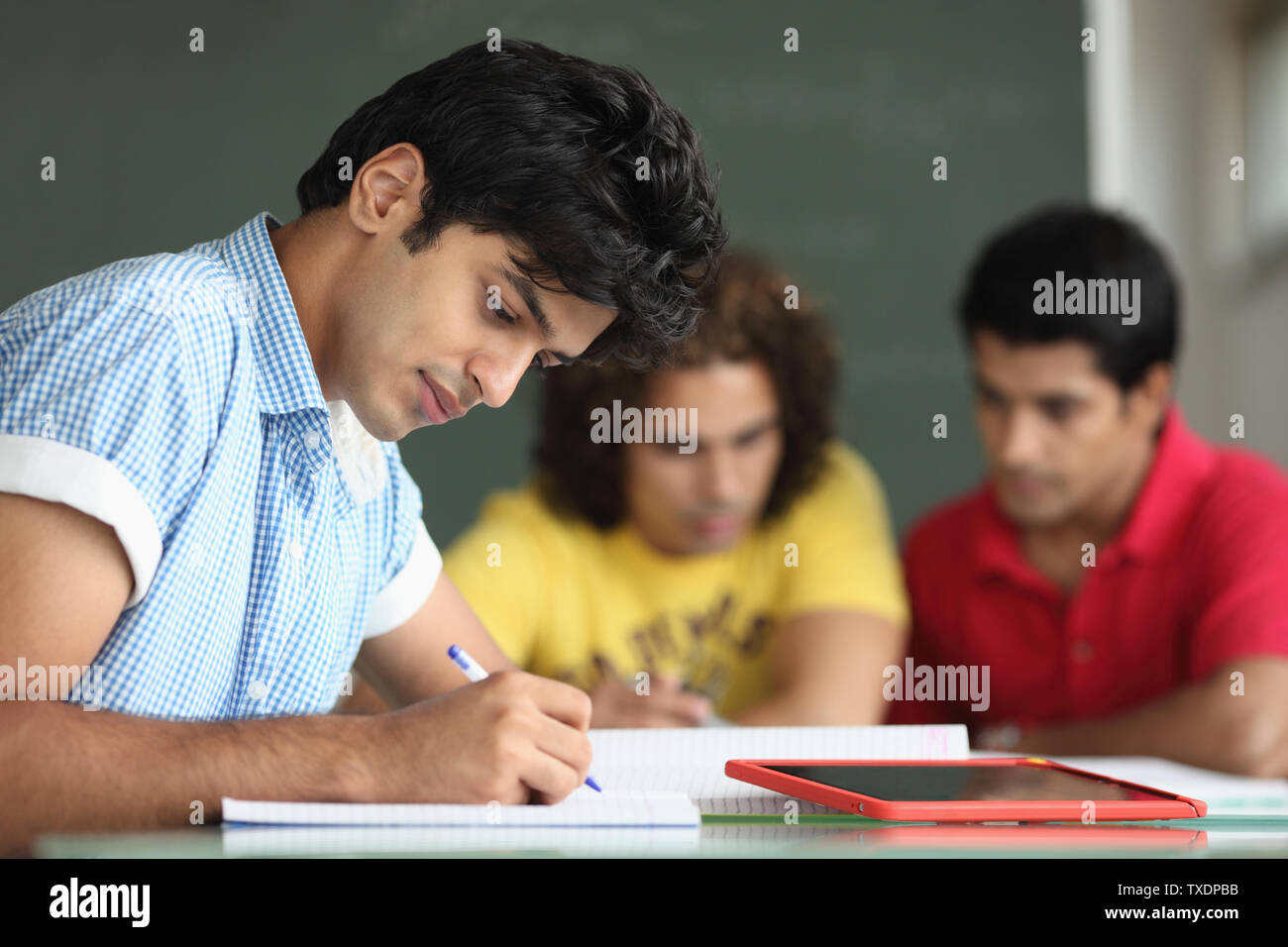 College students studying in a classroom Stock Photo - Alamy