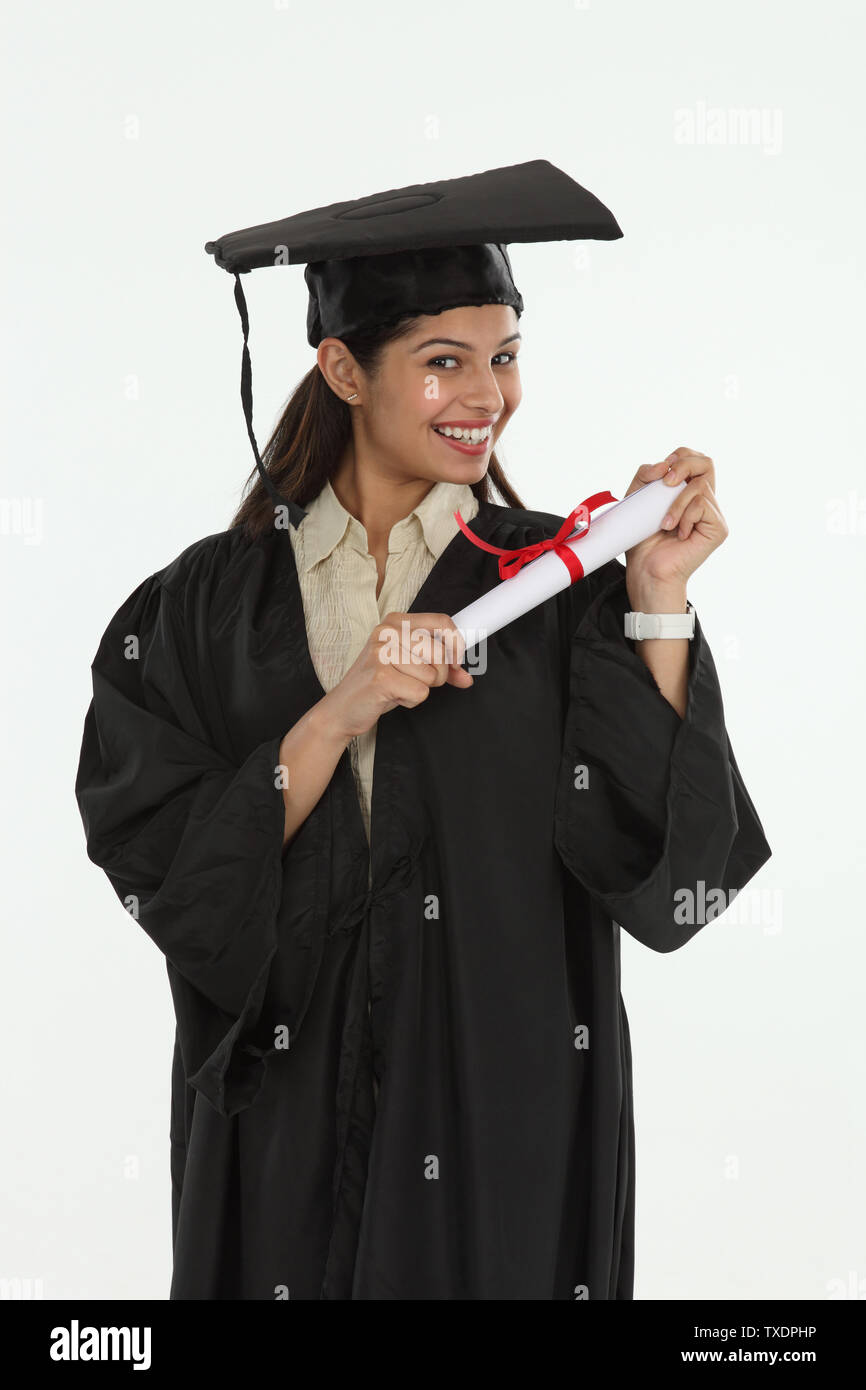 University student holding graduation degree Stock Photo - Alamy