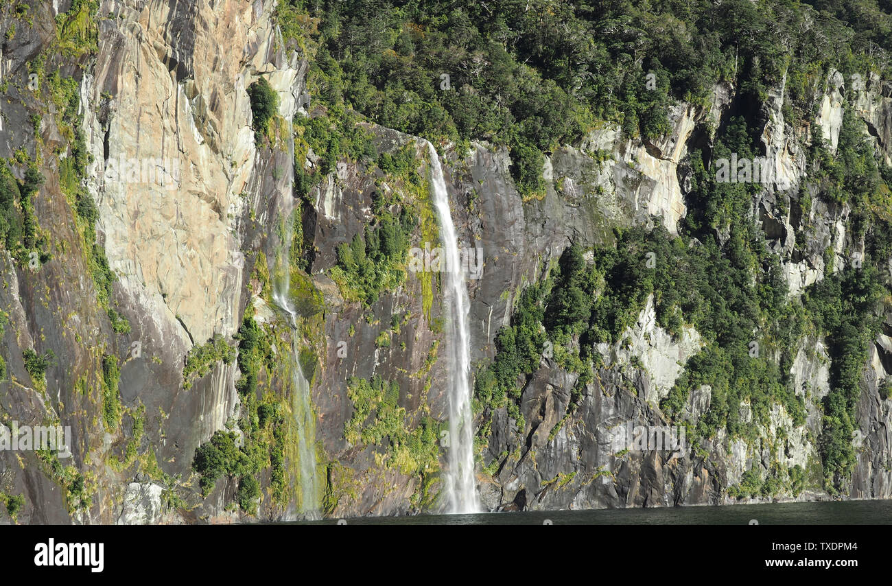 A couple waterfalls flow into the sea Stock Photo - Alamy