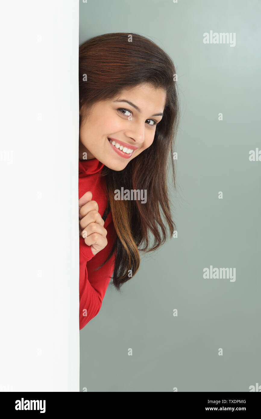 Portrait indian girl hiding behind hi-res stock photography and images ...