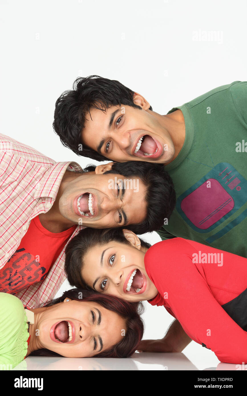 Portrait of four friends shouting Stock Photo - Alamy