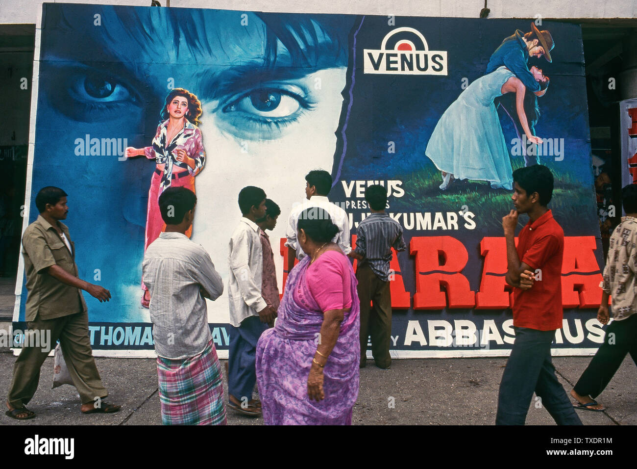 People seeing hand painted Bollywood film hoarding, Mumbai, Maharashtra ...