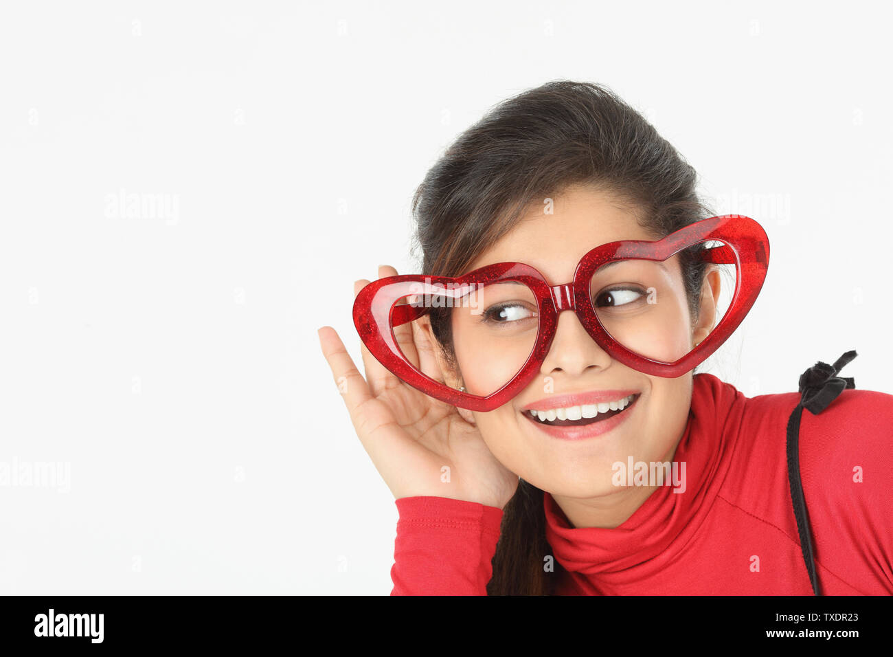 Young woman cupping hand ear hi-res stock photography and images - Alamy