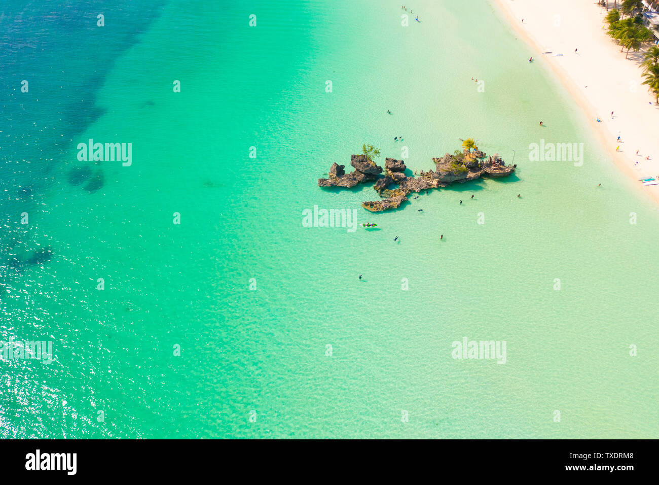 White sand beach and lagoon with turquoise water, aerial view. Coast of ...