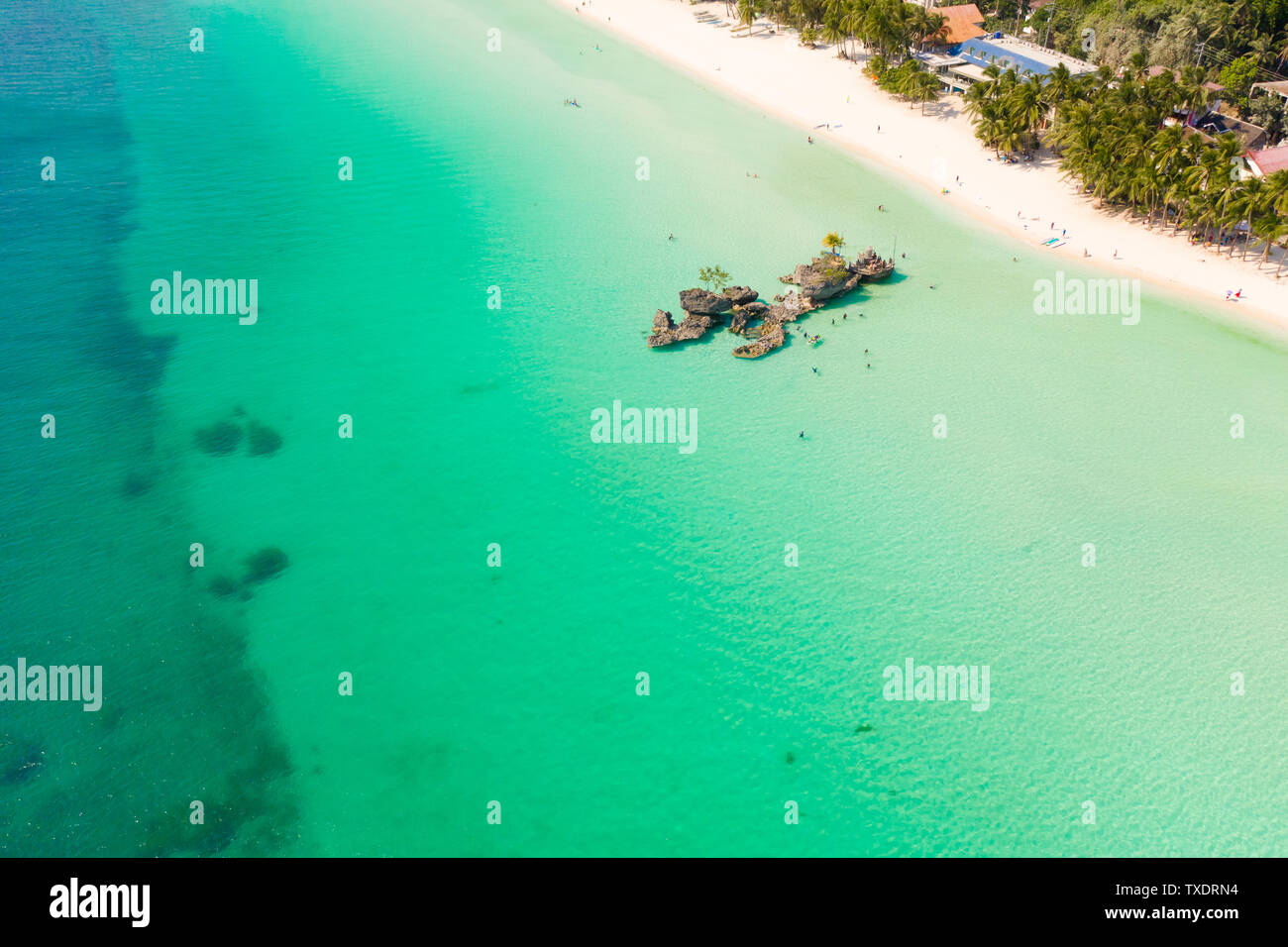 White sand beach and lagoon with turquoise water, aerial view. Coast of ...