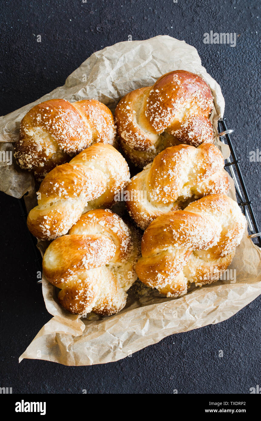 Baked fresh fragrant buns. Traditional homemade pastries. Pigtail buns ...