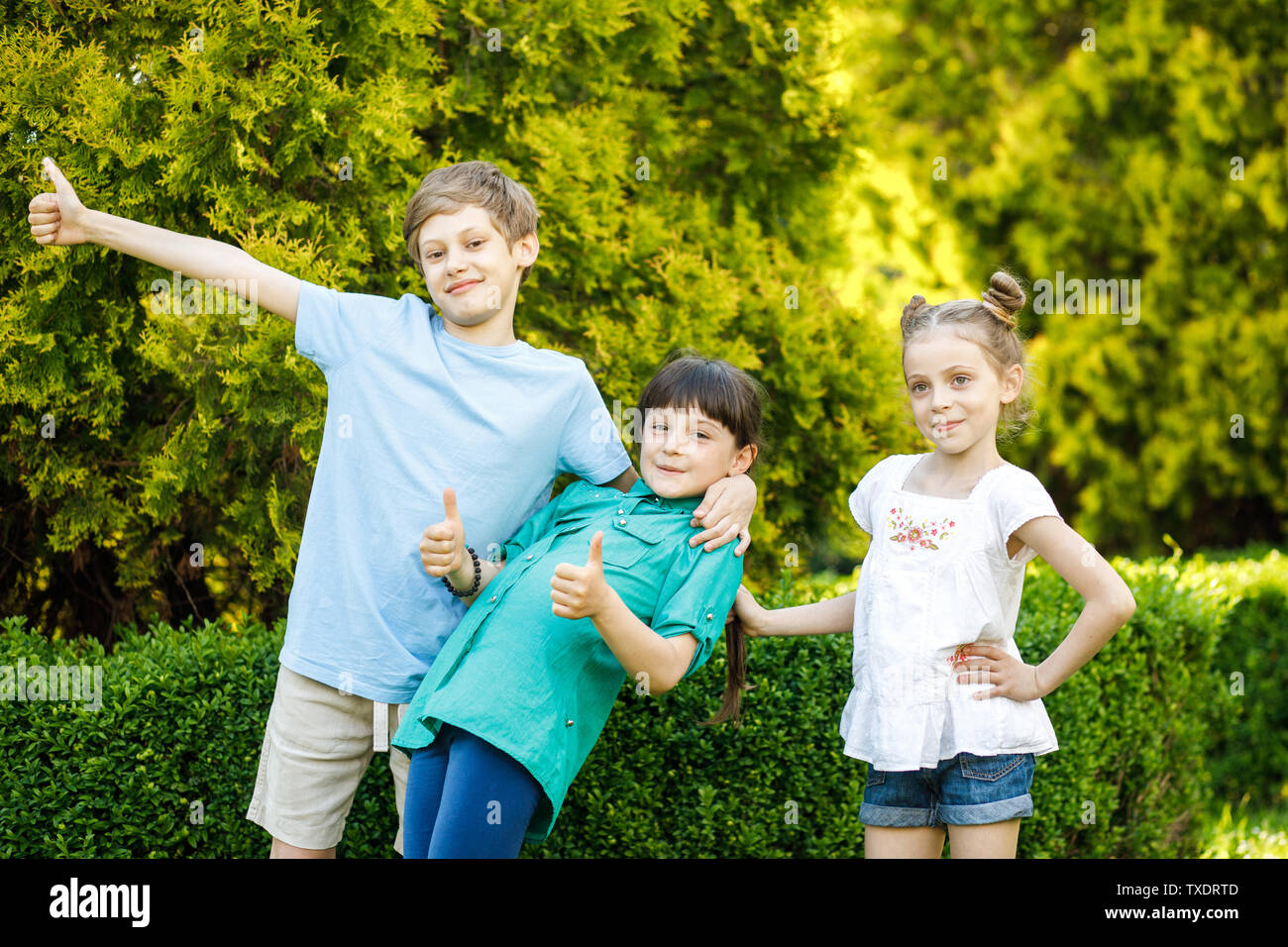 Group of happy children playing outdoors. Kids having fun in summer ...
