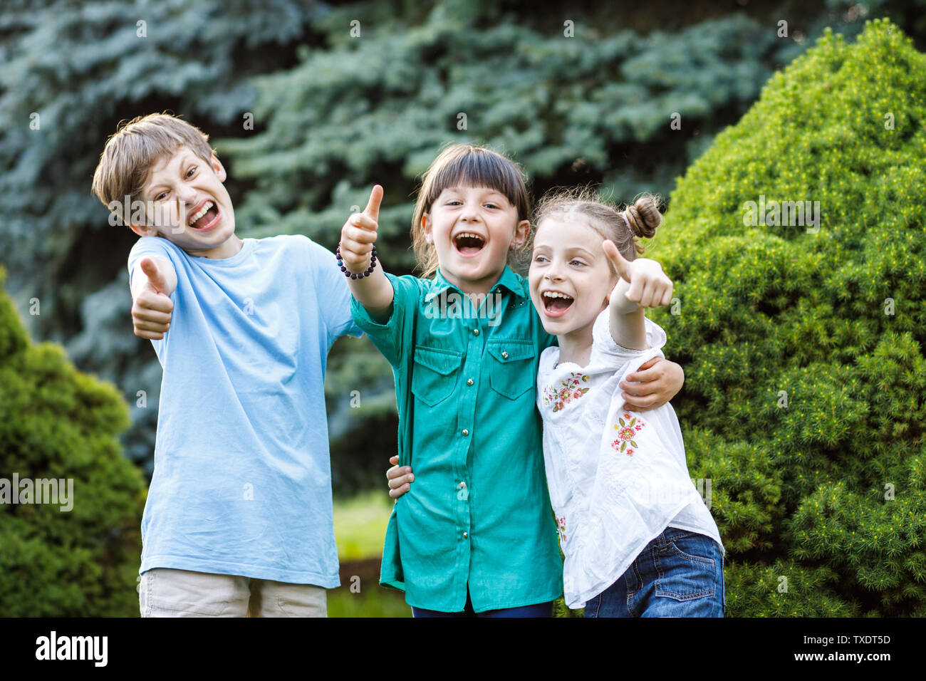 Group of happy children playing outdoors. Kids having fun in summer ...
