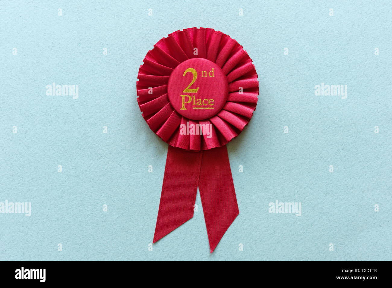 Red 2nd Place Winners rosette on light blue background placed in the ...