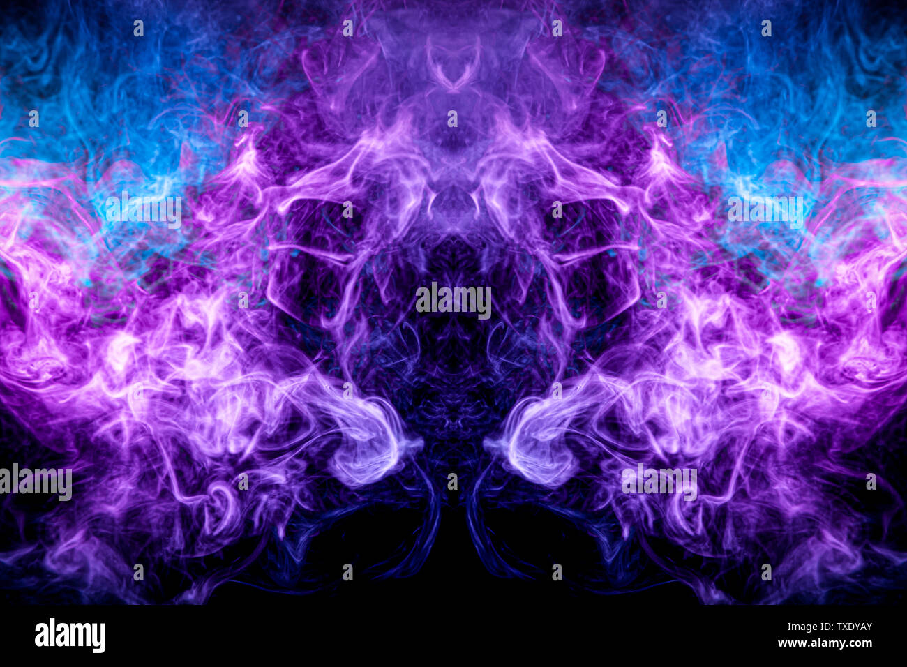 Toxic movement of blue and purple color smoke abstract on black ...