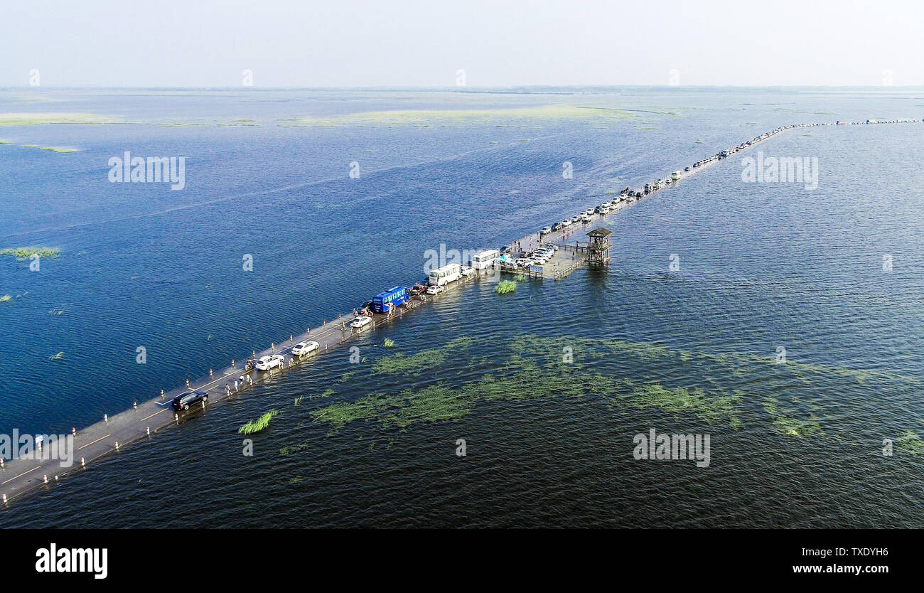 Jiujiang, China. 24th June, 2019. Vehicles are running on water in ...