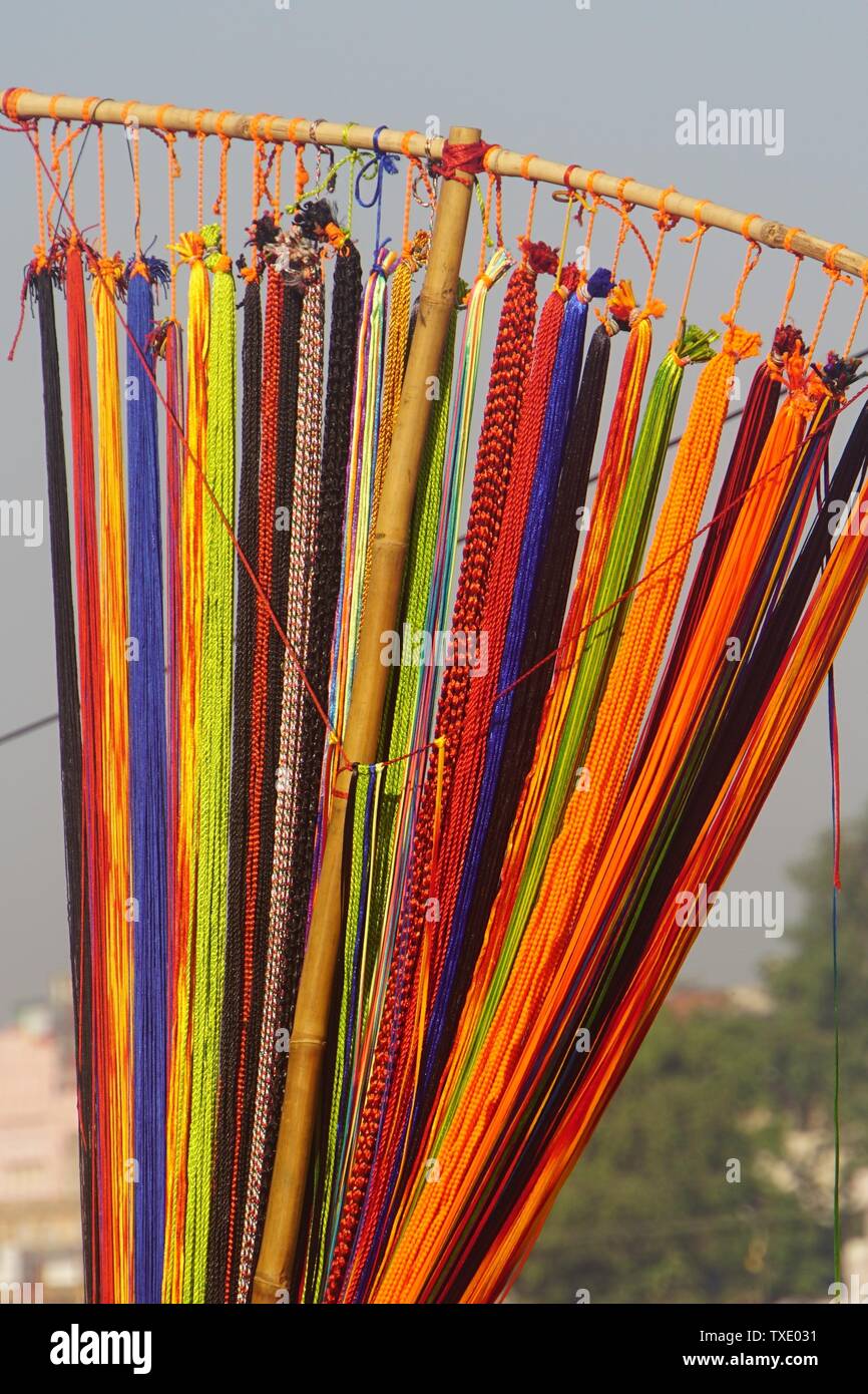 Bamboo Pole with brightly coloured Strings Stock Photo - Alamy