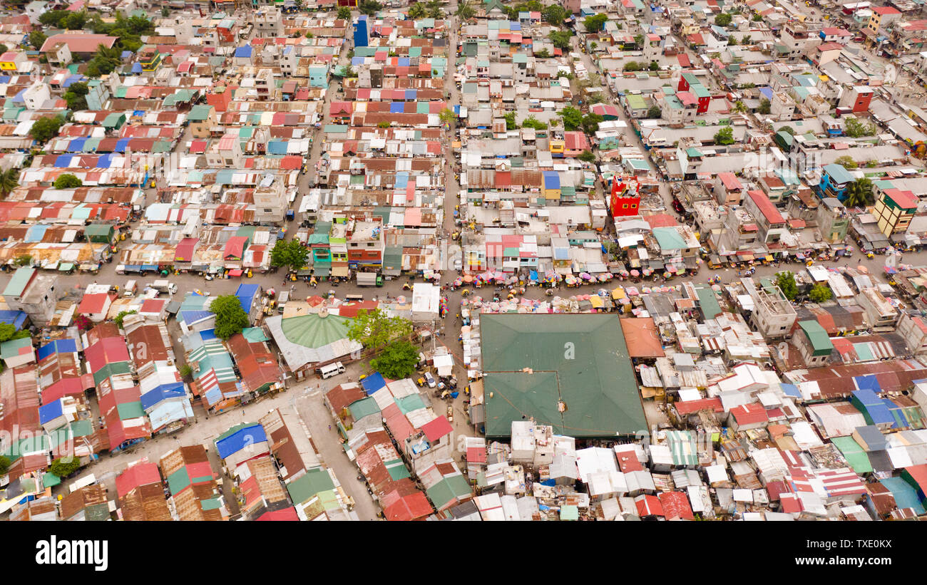 Streets of poor areas in Manila. The roofs of houses and the life of ...