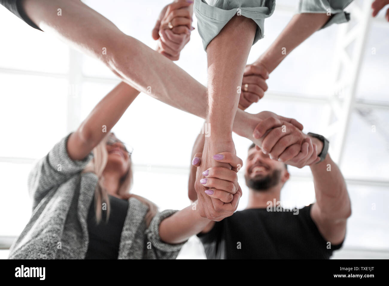 United hands on white background Stock Photo - Alamy
