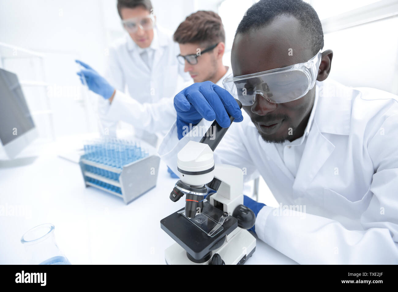 modern scientist uses a microscope in a laboratory Stock Photo - Alamy