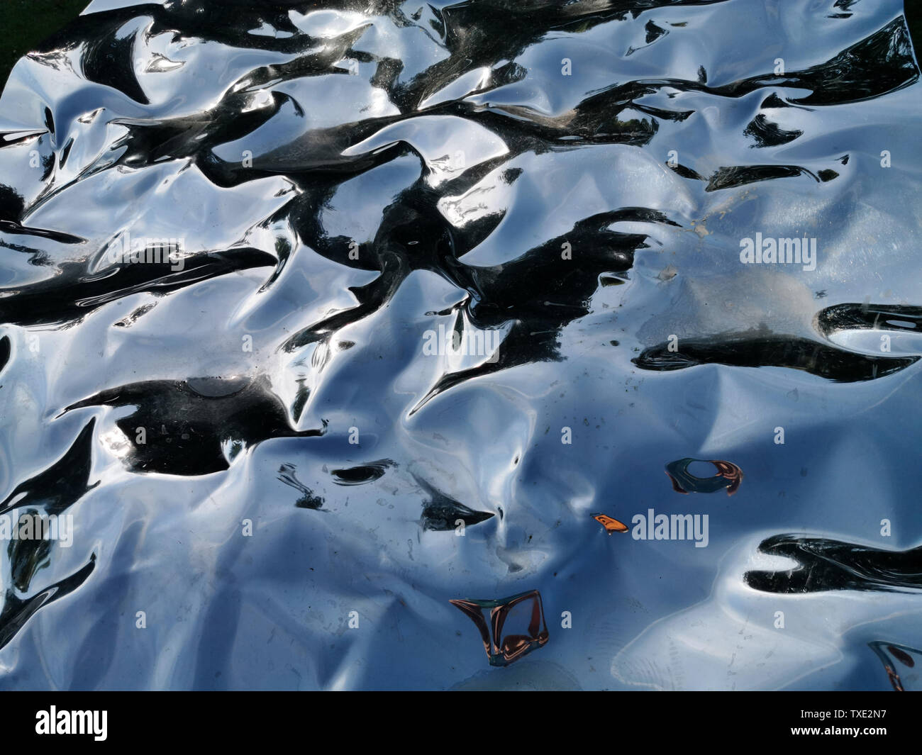 Metallic liquid reflection background texture Stock Photo - Alamy