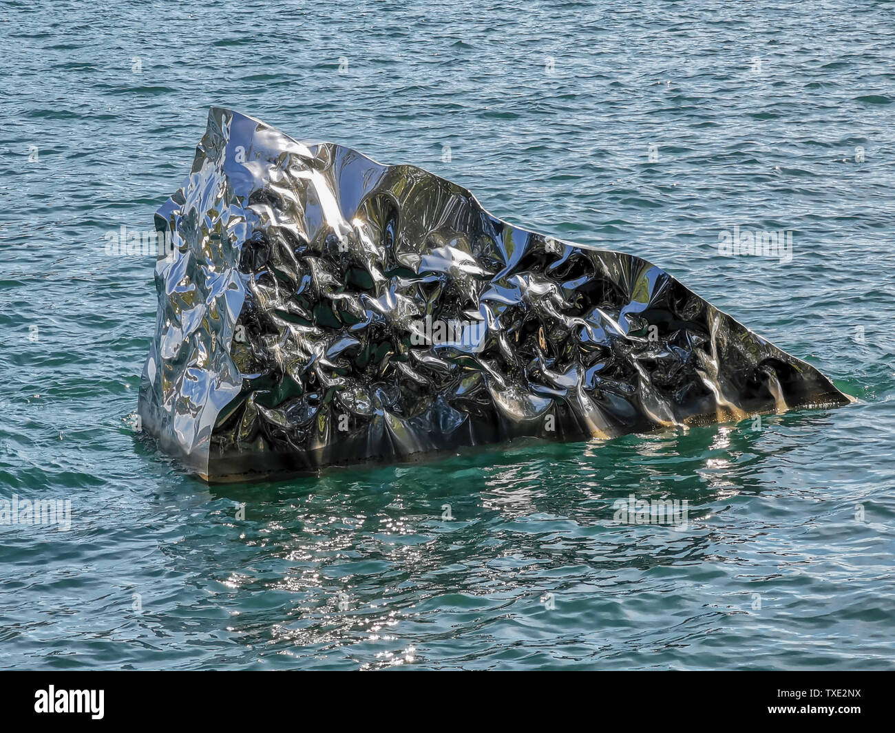 Metallic iceberg liquid reflection background texture Stock Photo - Alamy