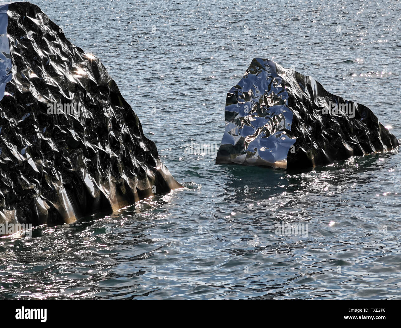 Metallic iceberg liquid reflection background texture Stock Photo - Alamy