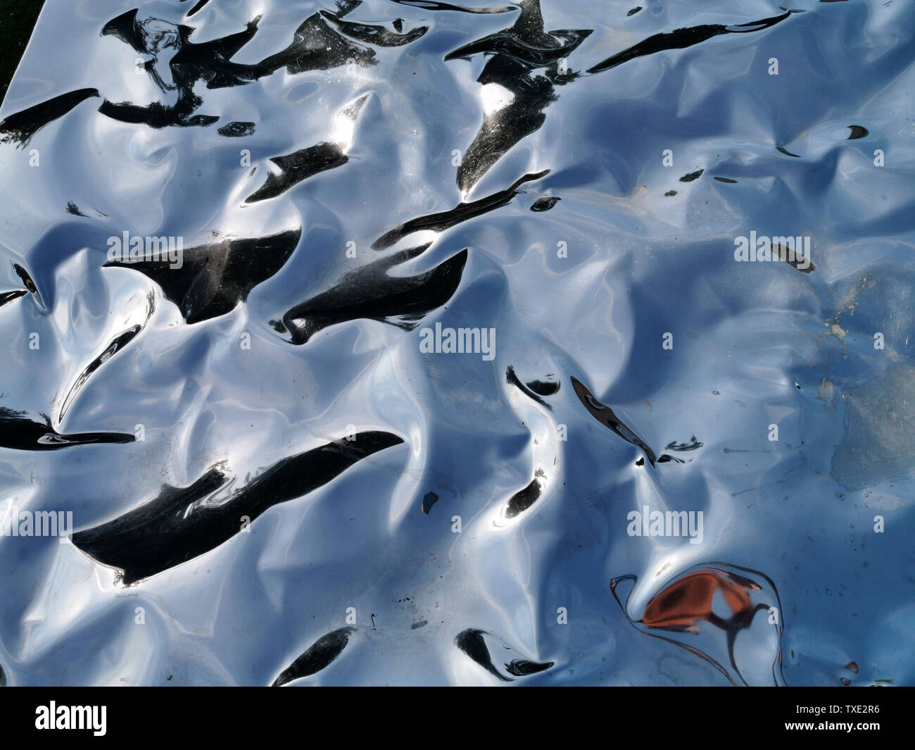 Metallic liquid reflection background texture Stock Photo - Alamy