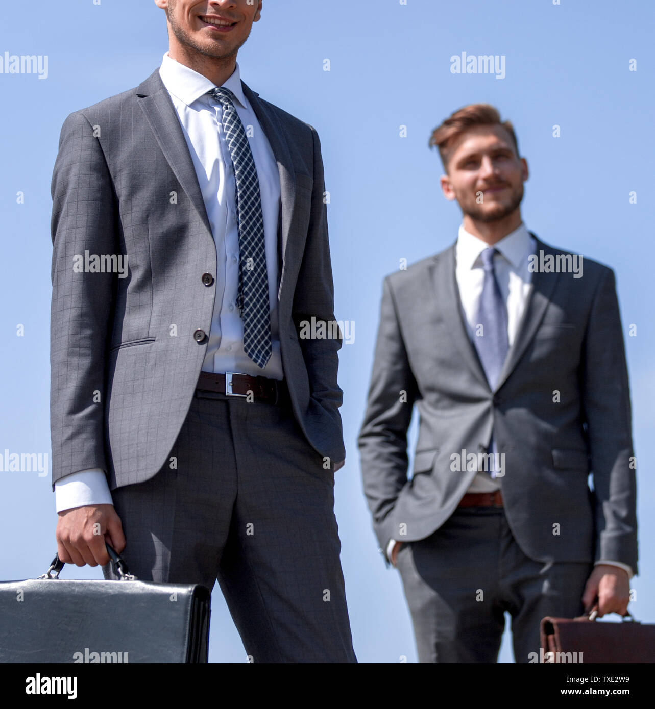two business men with leather briefcases Stock Photo - Alamy