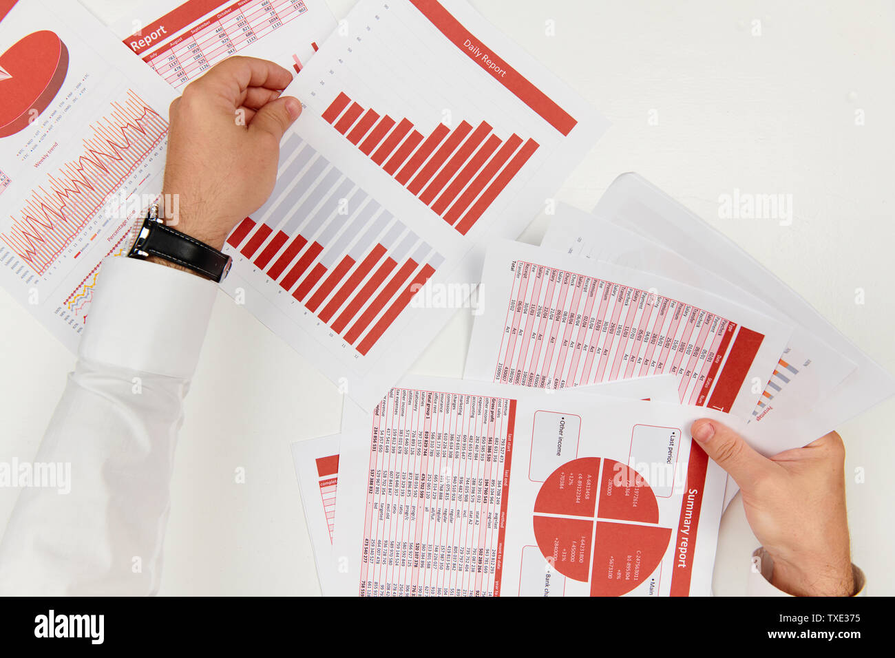 Business reports, data tables and charts - directly above view of ...