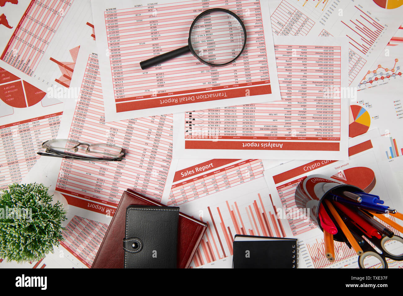 Flat top view of business workspace - reports with data, tables and ...