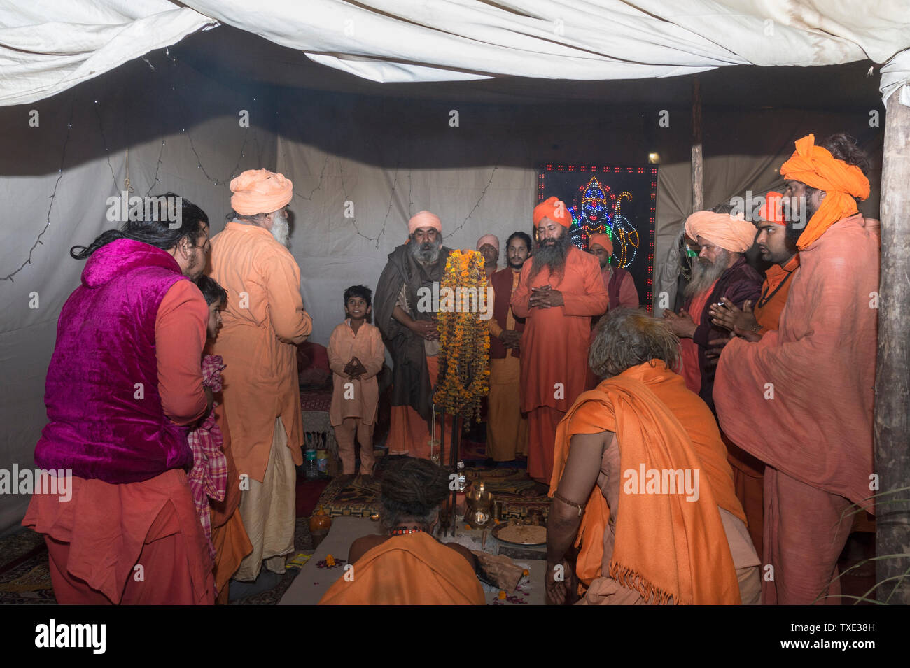 Pilgrims gathered and meditating in a tent, Allahabad Kumbh Mela, World ...