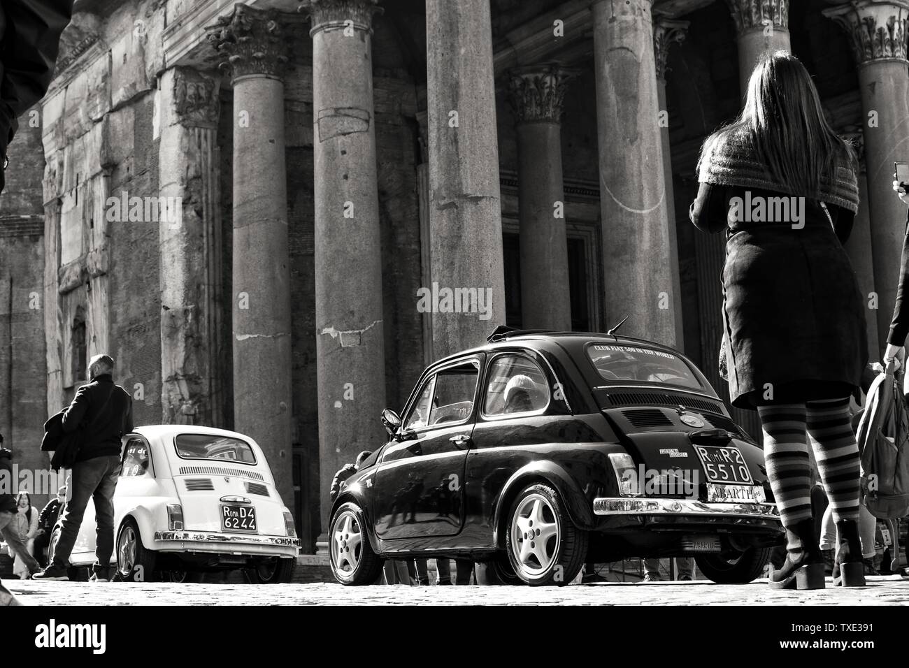Two classic Fiat cars on the street of Rome, with columns of Pantheon ...