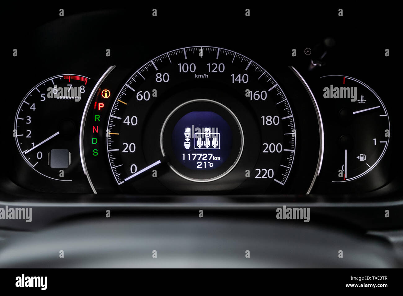 Car dashboard wuth red backlight: Odometer, speedometer, tachometer ...