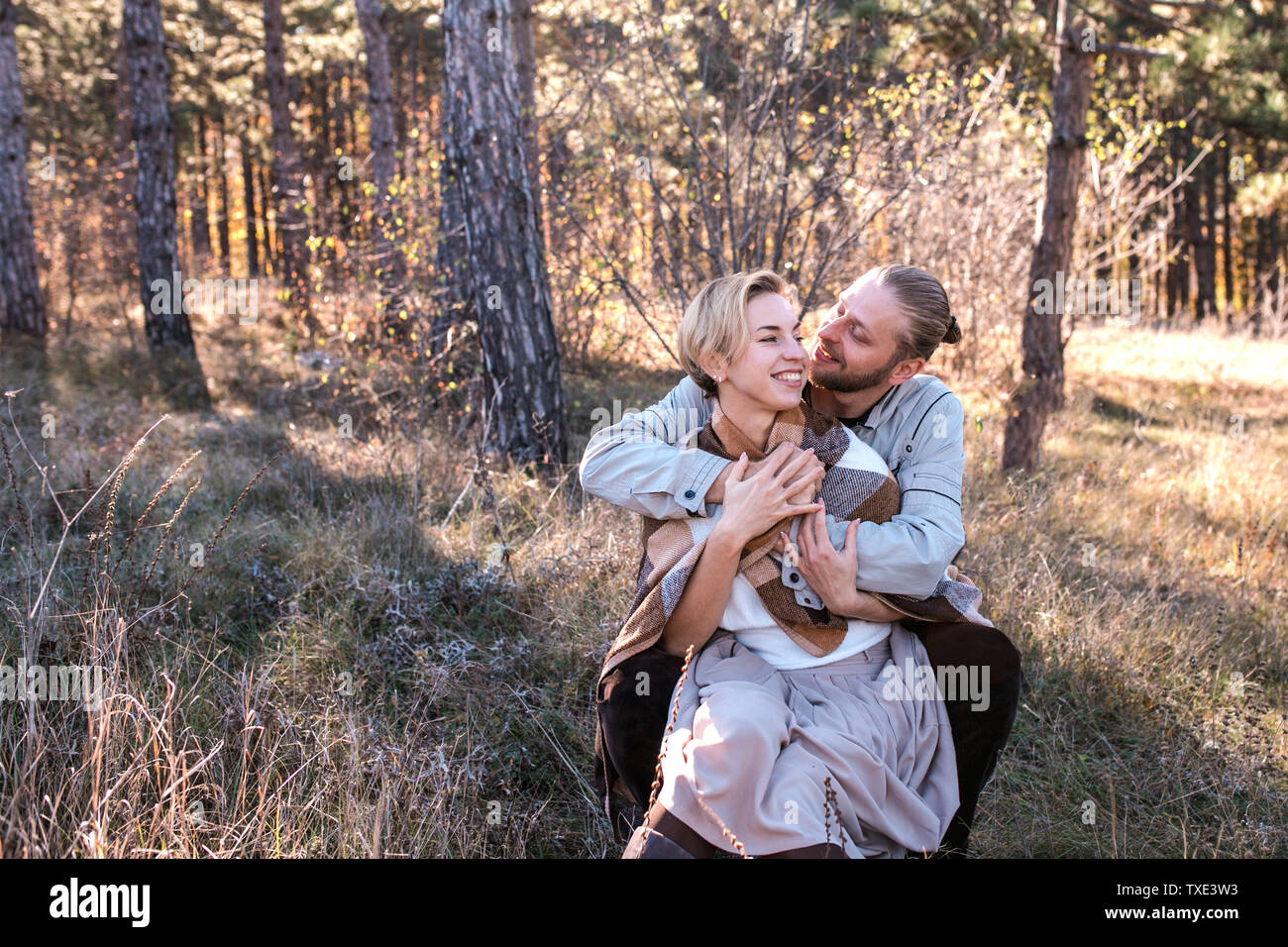 Couple in love hugging in the forest Stock Photo - Alamy