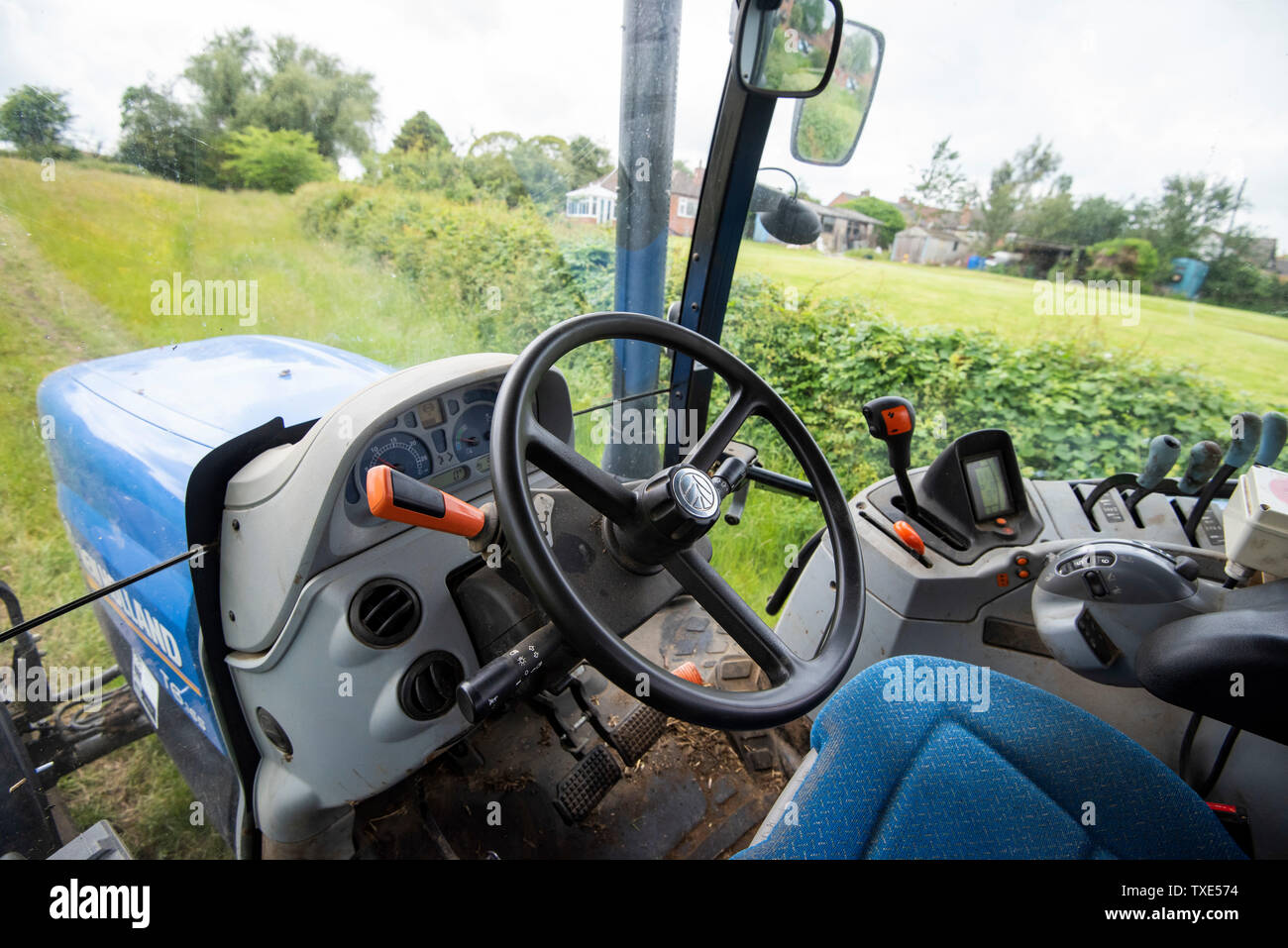 Tractor being driven on a public road hi-res stock photography and ...