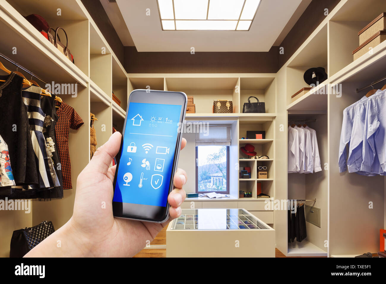 smart phone with smart home with modern wardrobe Stock Photo - Alamy